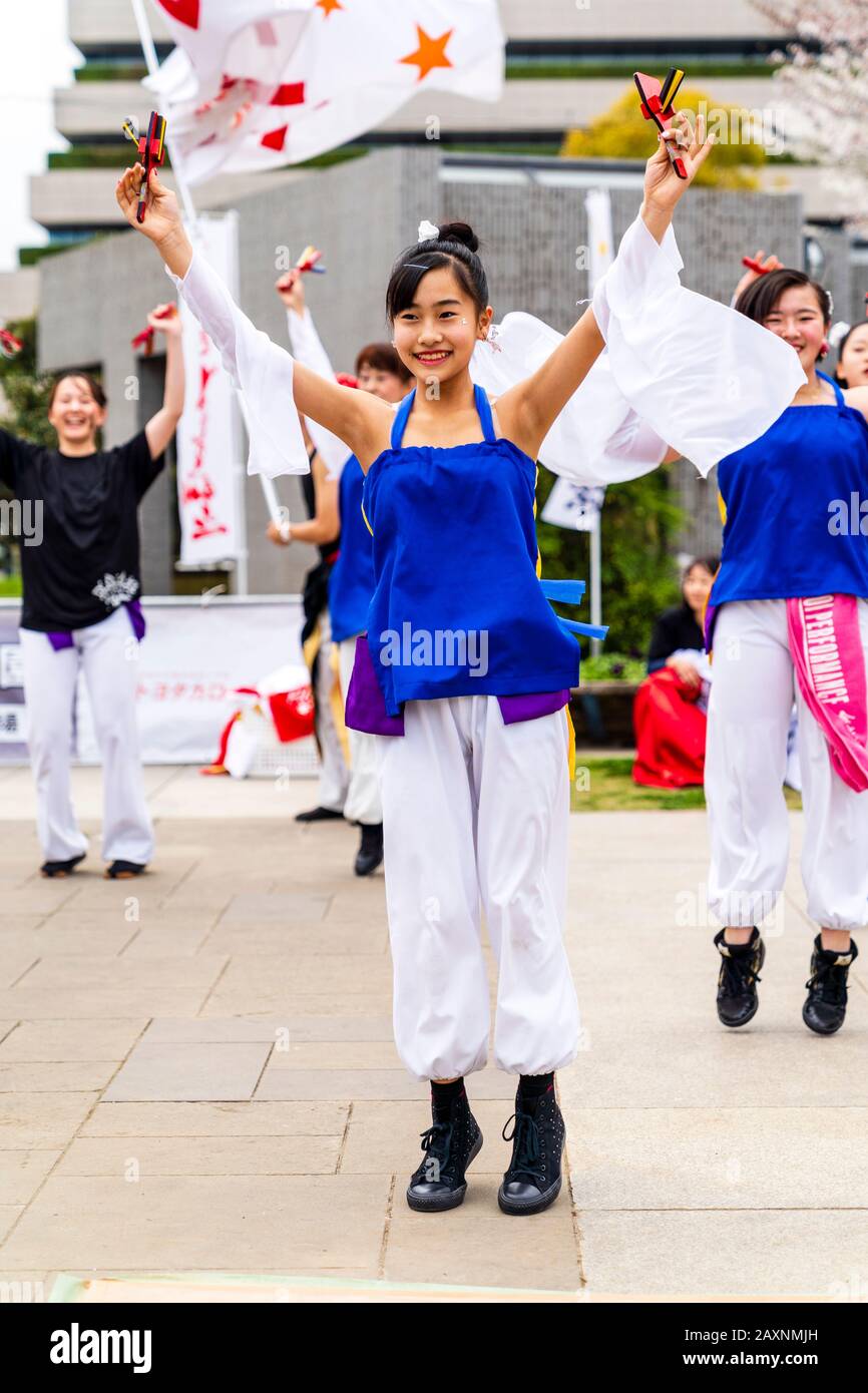 Young teenage Japanese Yosakoi dance group, dancing in public square at ...