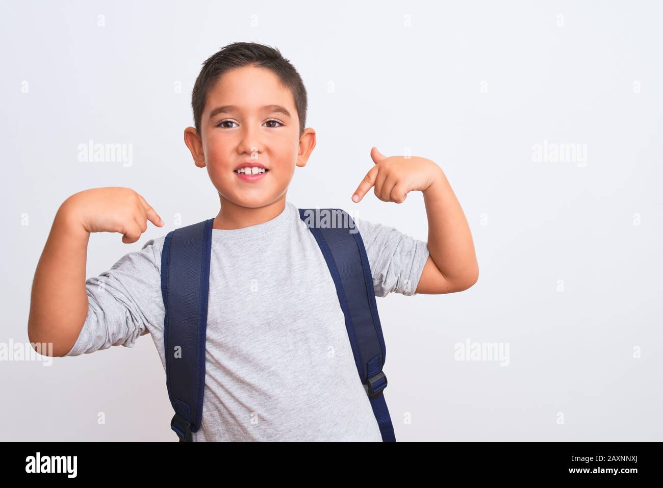 Beautiful student kid boy wearing backpack standing over isolated white ...