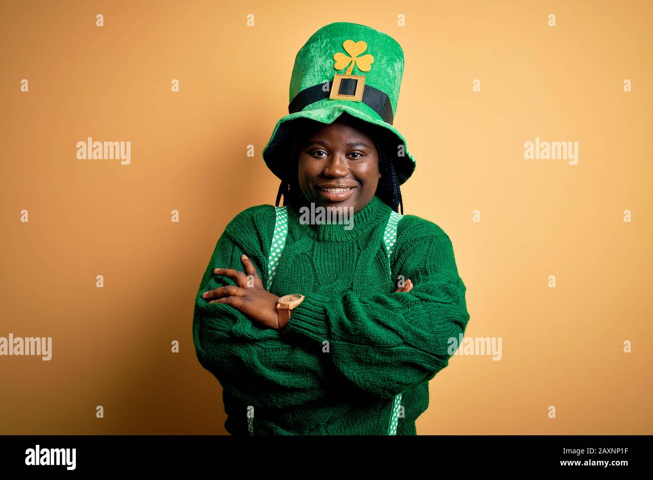 Plus size african american woman with braids wearing green hat with ...