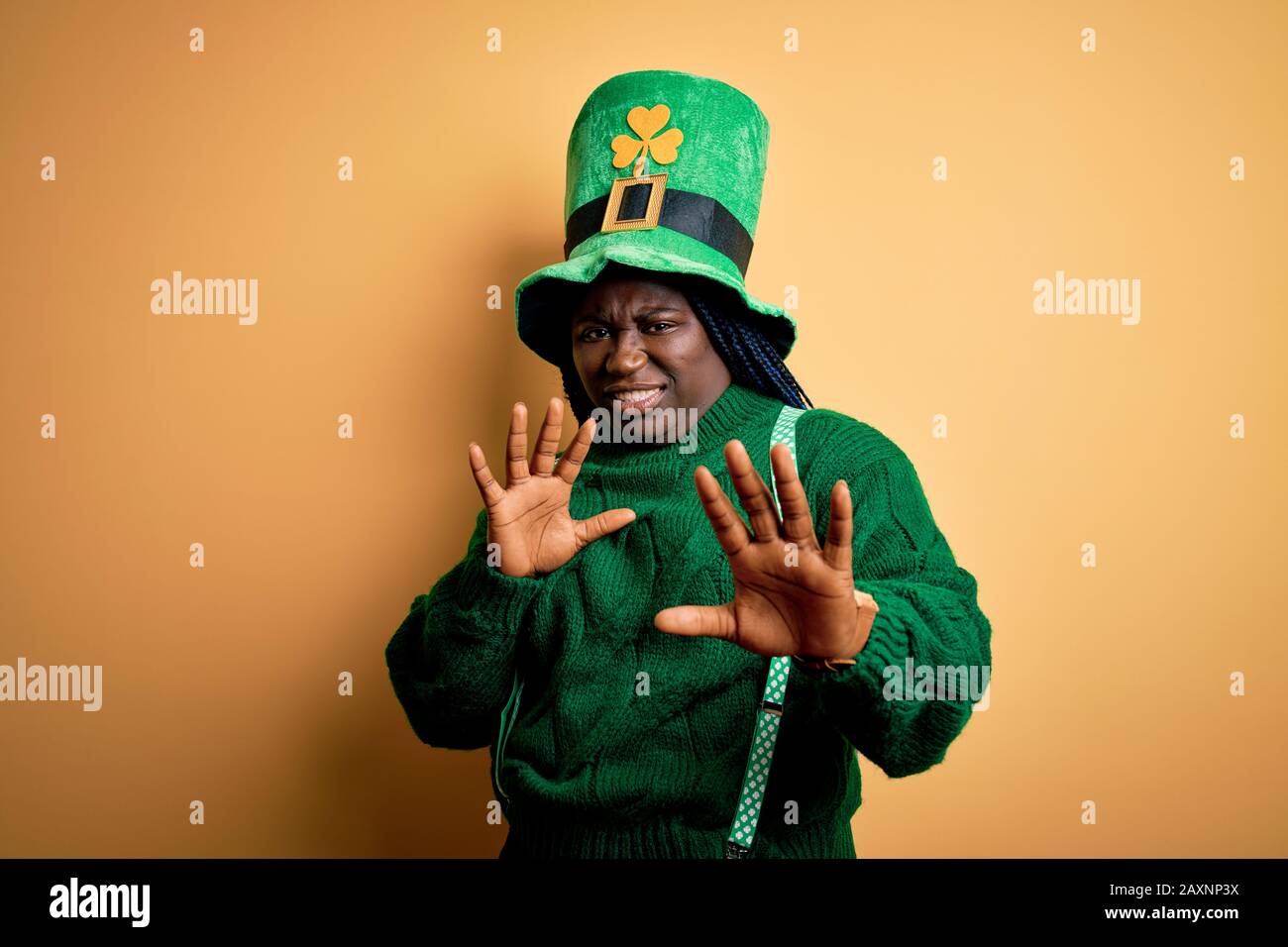 Plus size african american woman with braids wearing green hat with ...