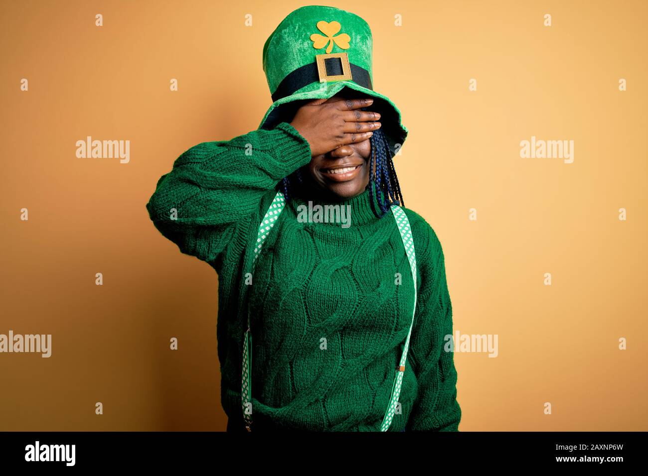 Plus size african american woman with braids wearing green hat with ...