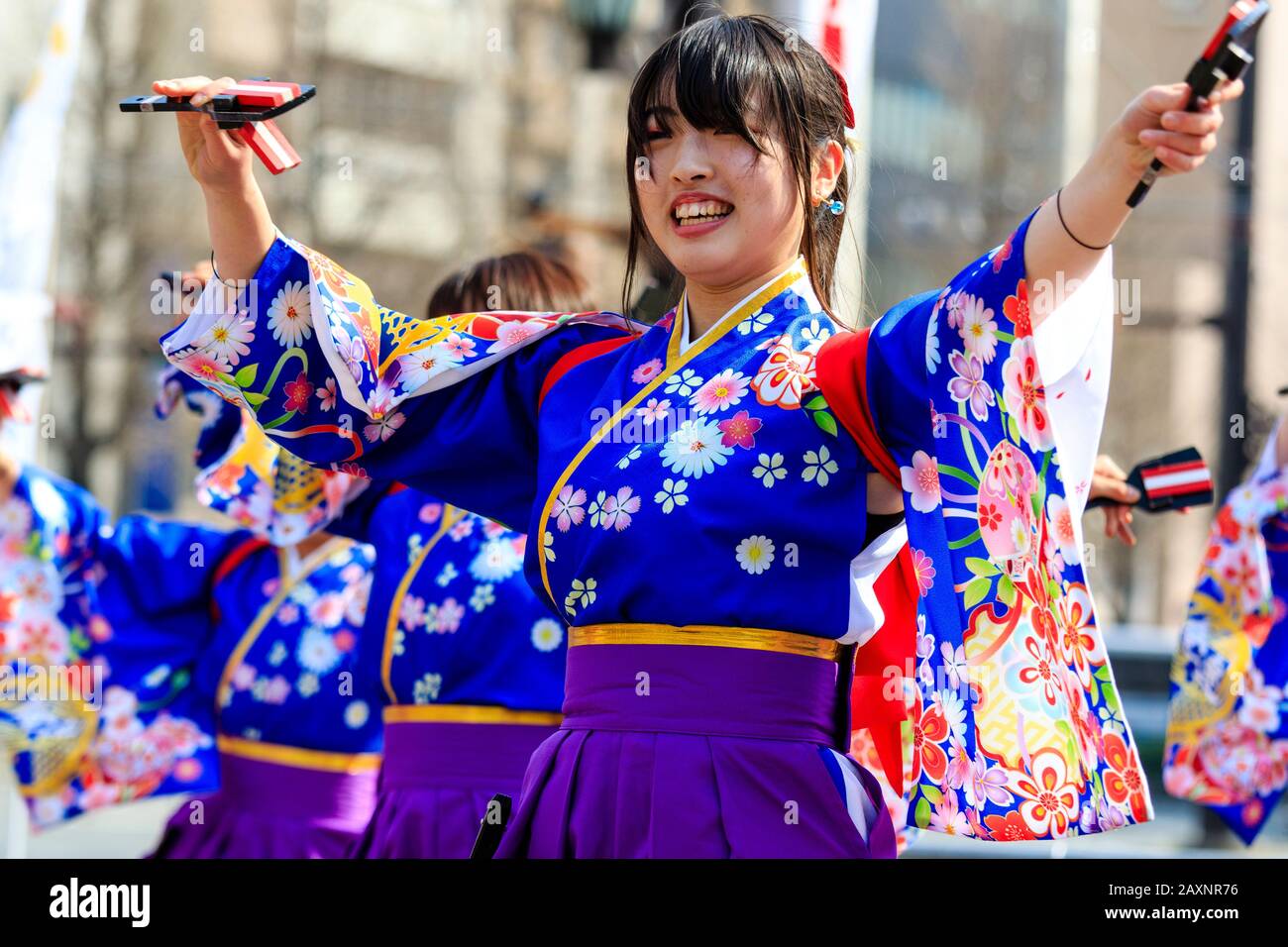 Close up of young Japanese woman dancing with a yosakoi dance group at ...
