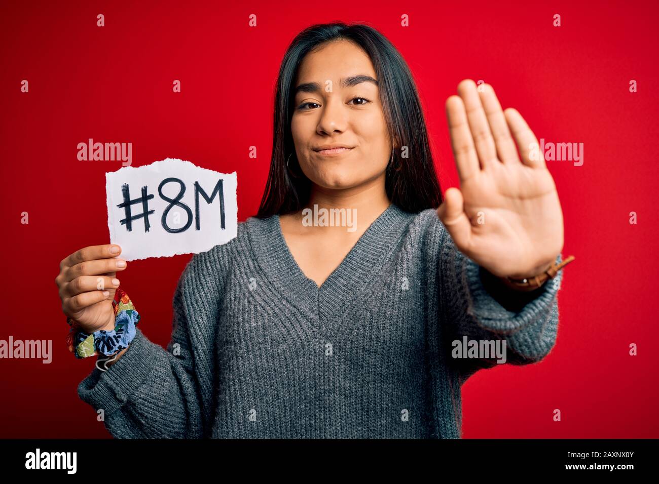 Young beautiful asian woman celebrating 8th march womens day holding ...