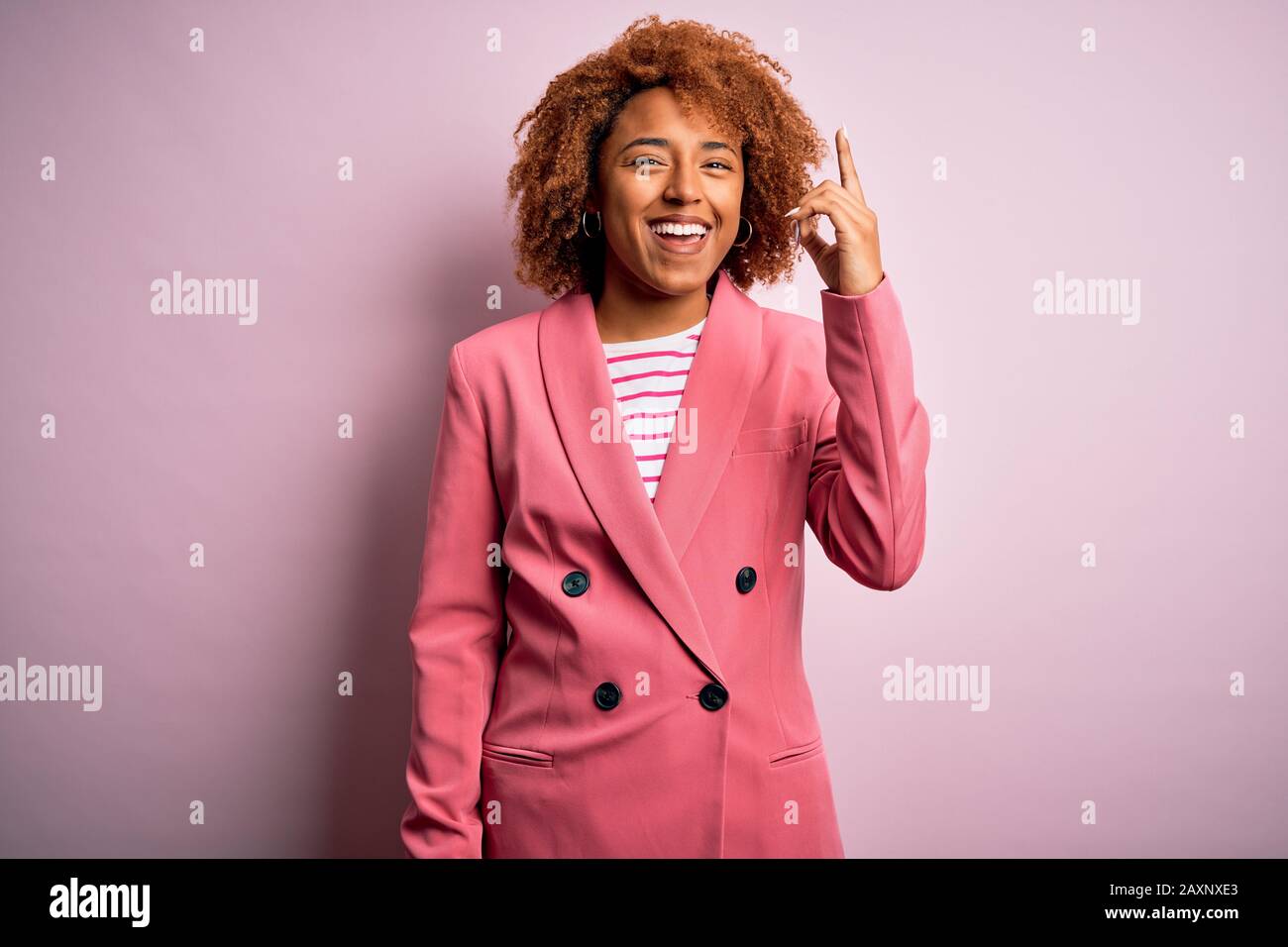 Young Beautiful African American Businesswoman With Curly Hair Wearing