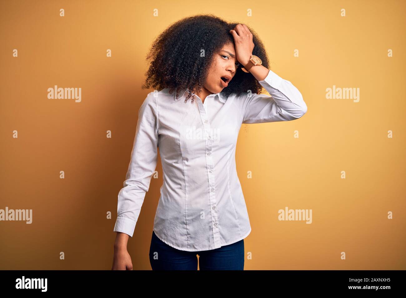 Young beautiful african american elegant woman with afro hair standing ...