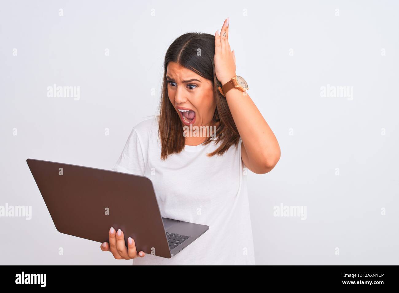Beautiful young woman working using computer laptop over white ...