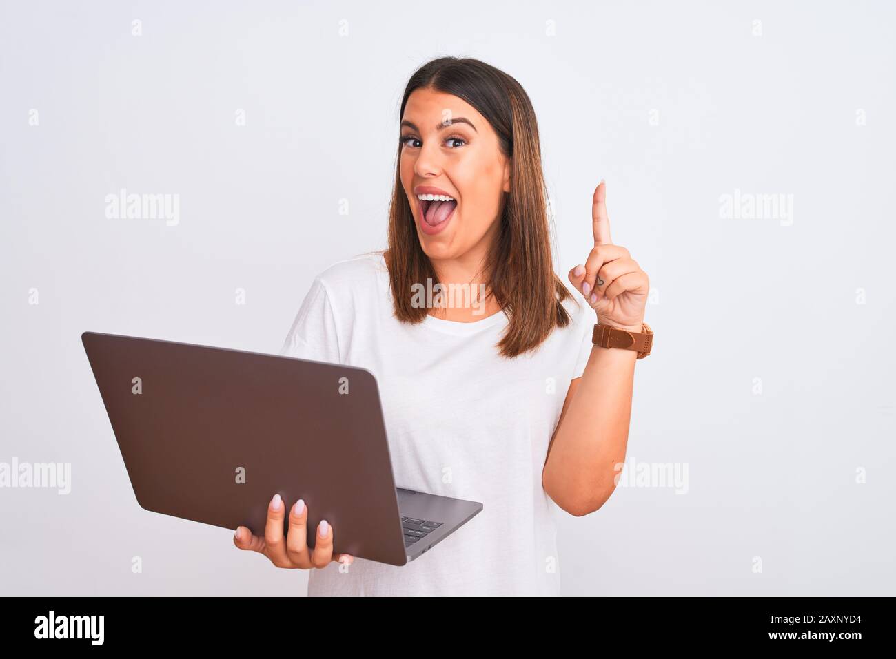 Beautiful young woman working using computer laptop over white ...