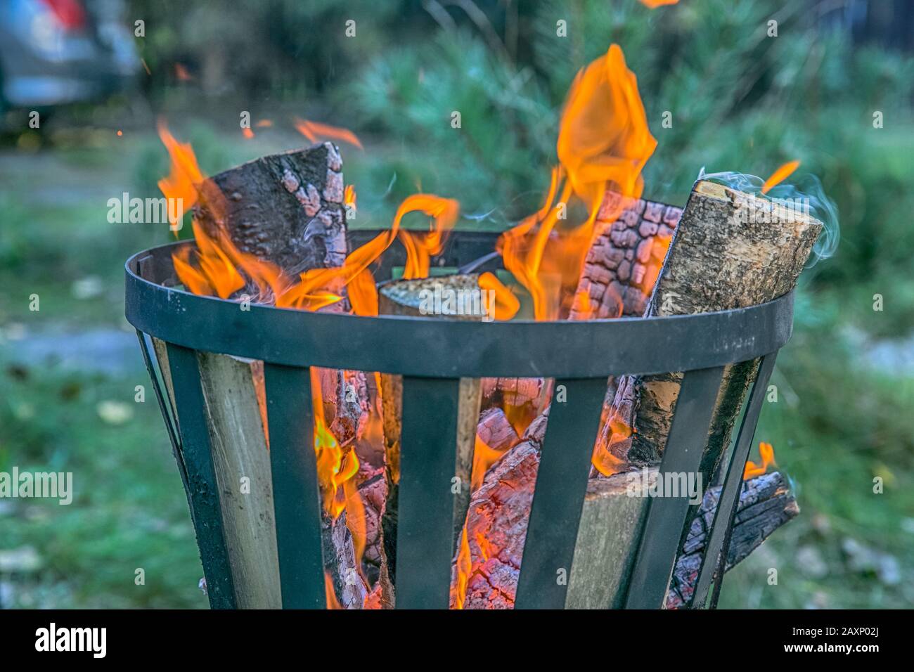 Fireplace in a metal hearth Stock Photo - Alamy