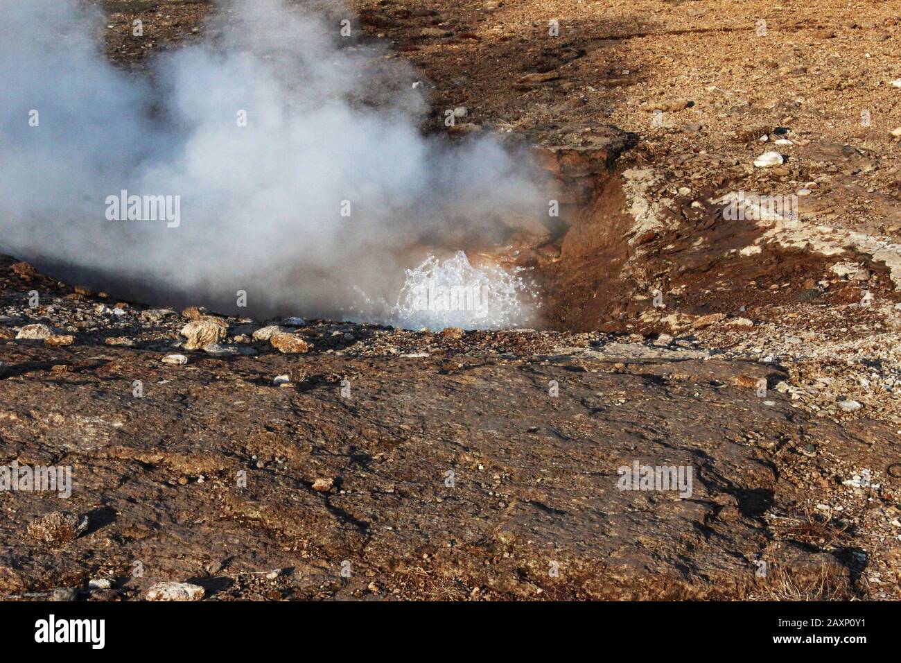 Mini geyser bubbling in Geysir Park, Iceland Stock Photo - Alamy