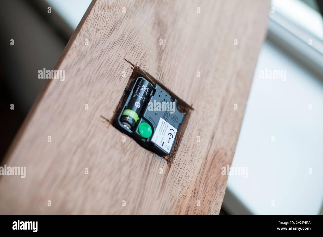 Back of a self-made clock: Shows the clockwork with battery integrated ...