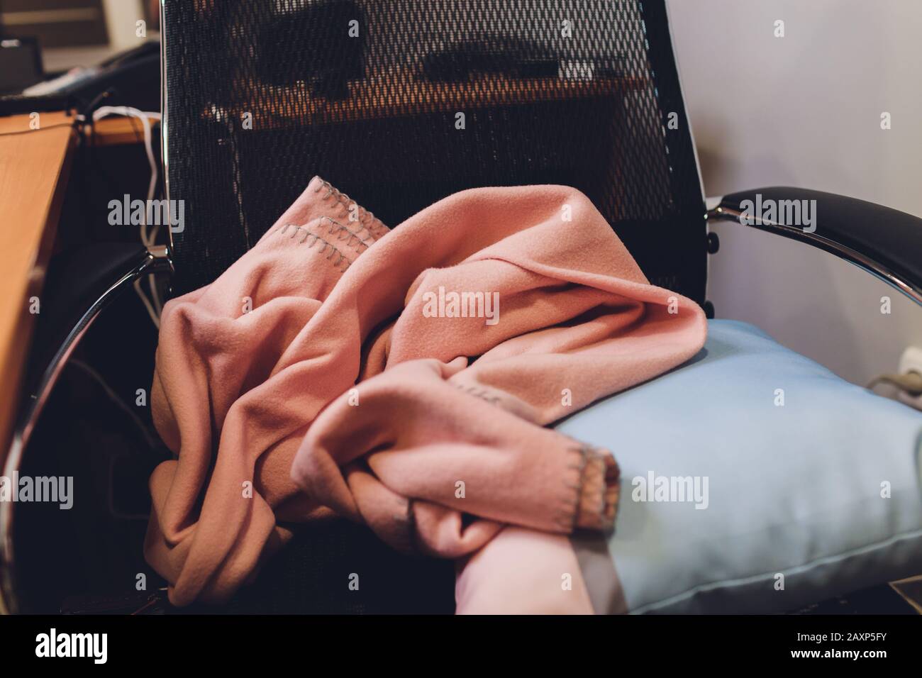 pink stole on an office chair close-up Stock Photo - Alamy