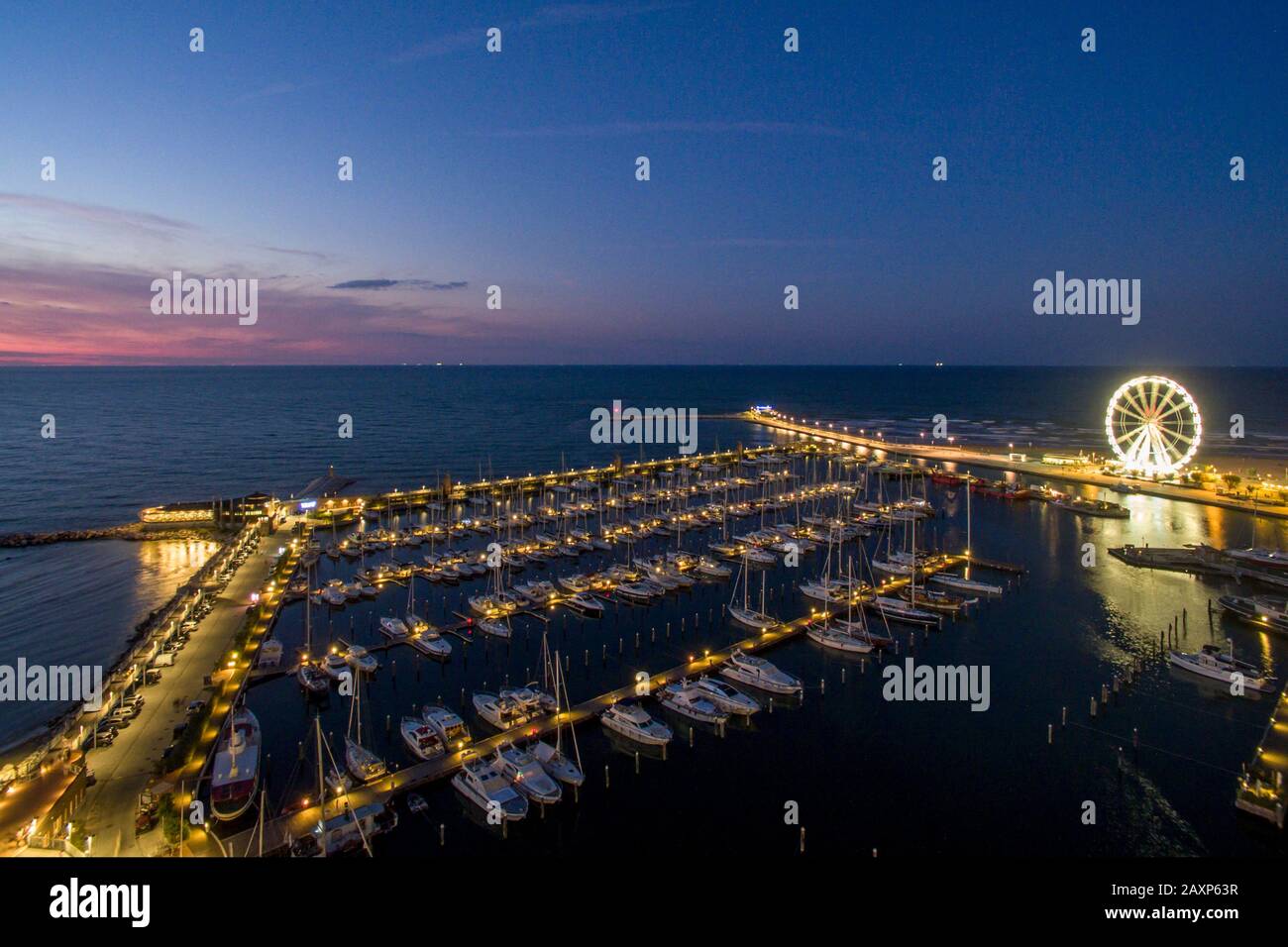 drone aerial view of rimini sea beach and harbour at twilight and dawn ...