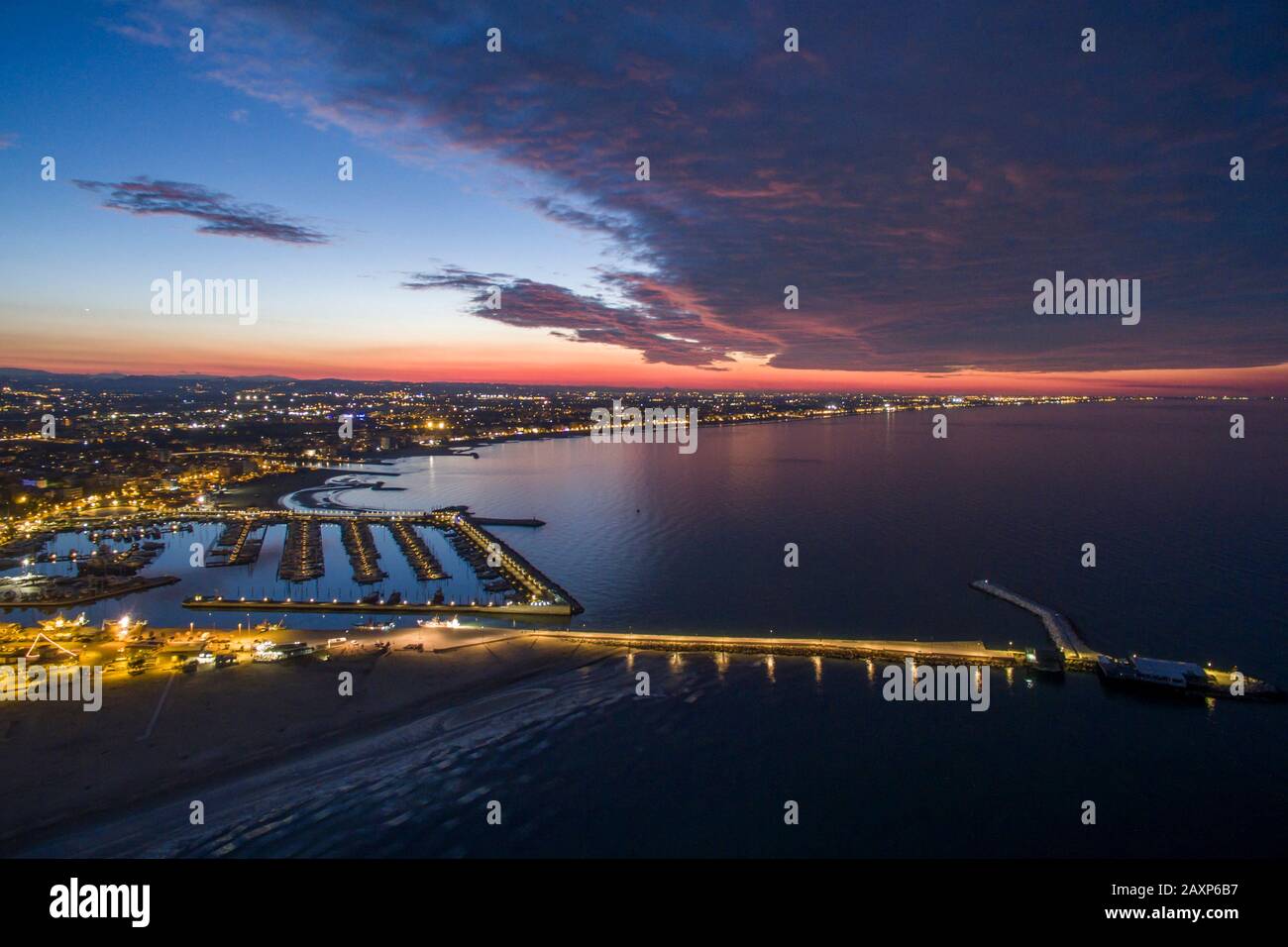 drone aerial view of rimini sea beach and harbour at twilight and dawn ...