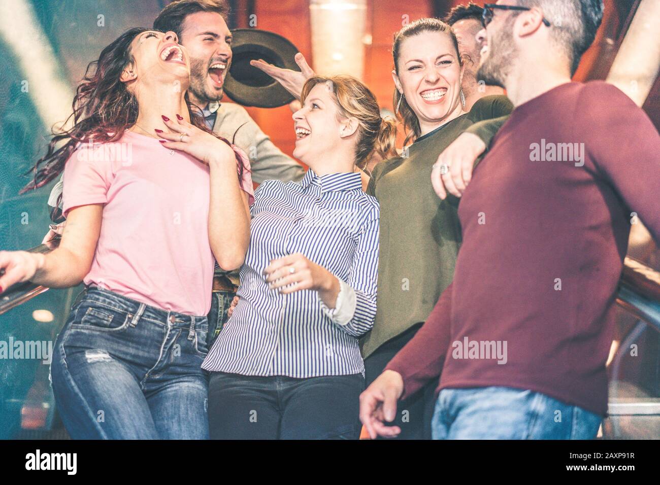 Group of happy friends having fun together on subway metro train ...