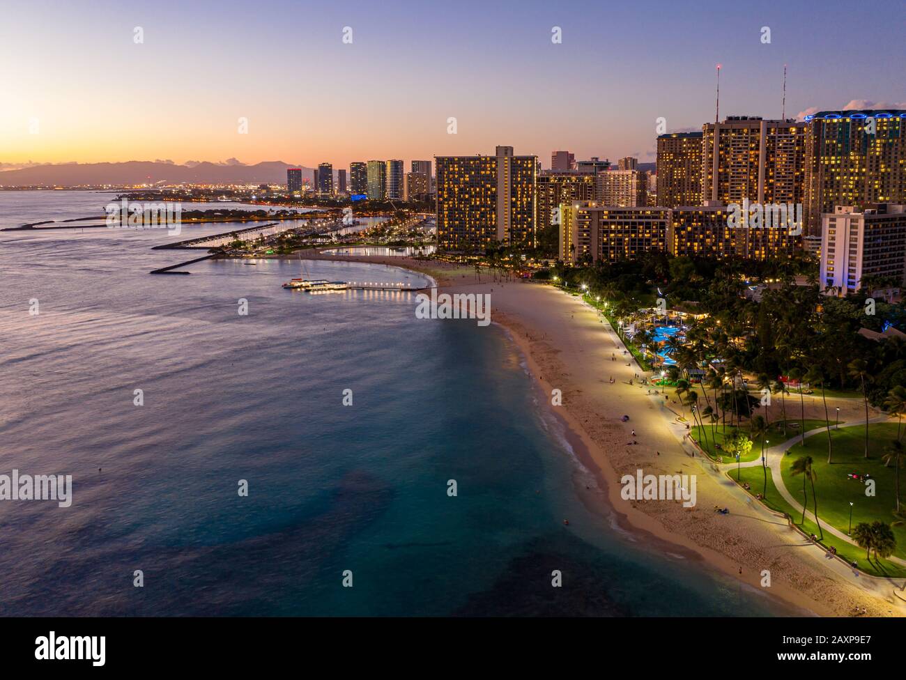 Aerial panorama of Waikiki beach and Honolulu on Oahu, Hawaii at sunset ...