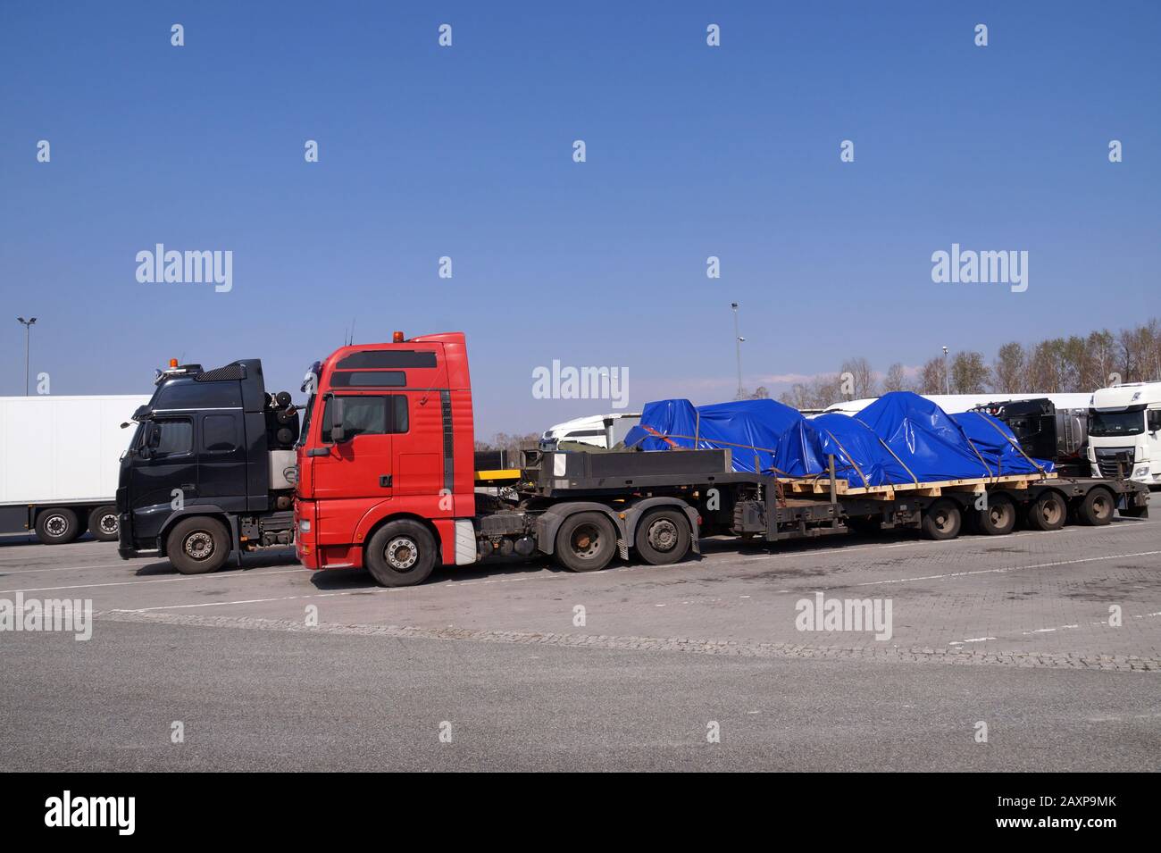 A truck with a special semi-trailer for transporting oversized loads ...