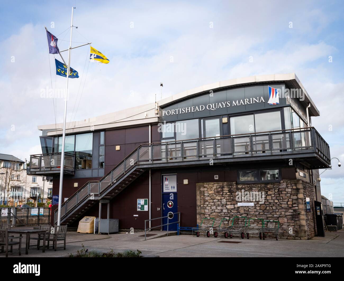 Portishead Quay Marina, England UK: Marina building with flags on a ...