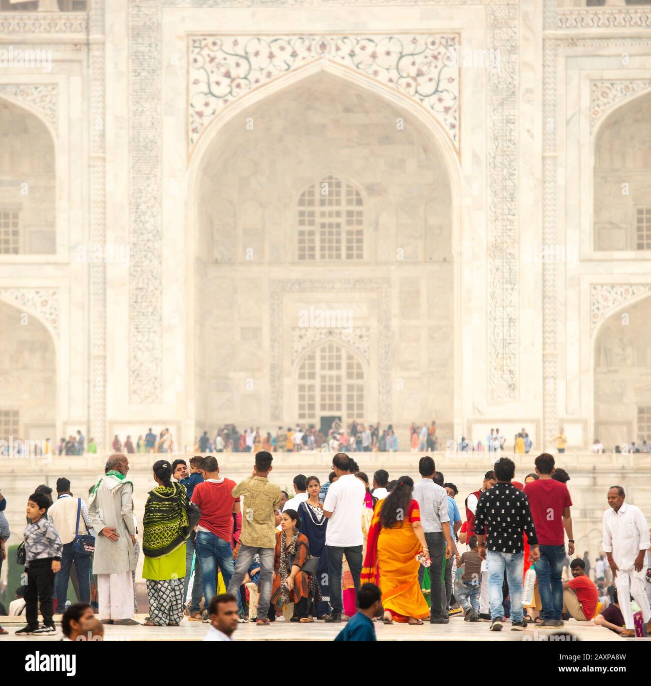 Visitors and tourist crowd the grounds of the TAJ MAHAL in Agra, India ...
