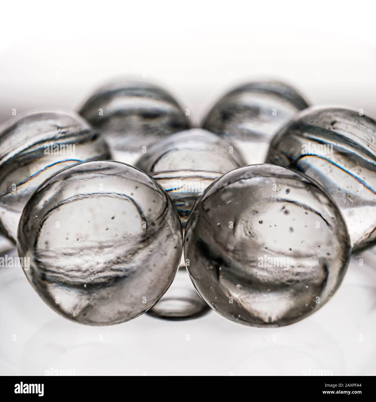 Seven marbles in perspective Stock Photo - Alamy