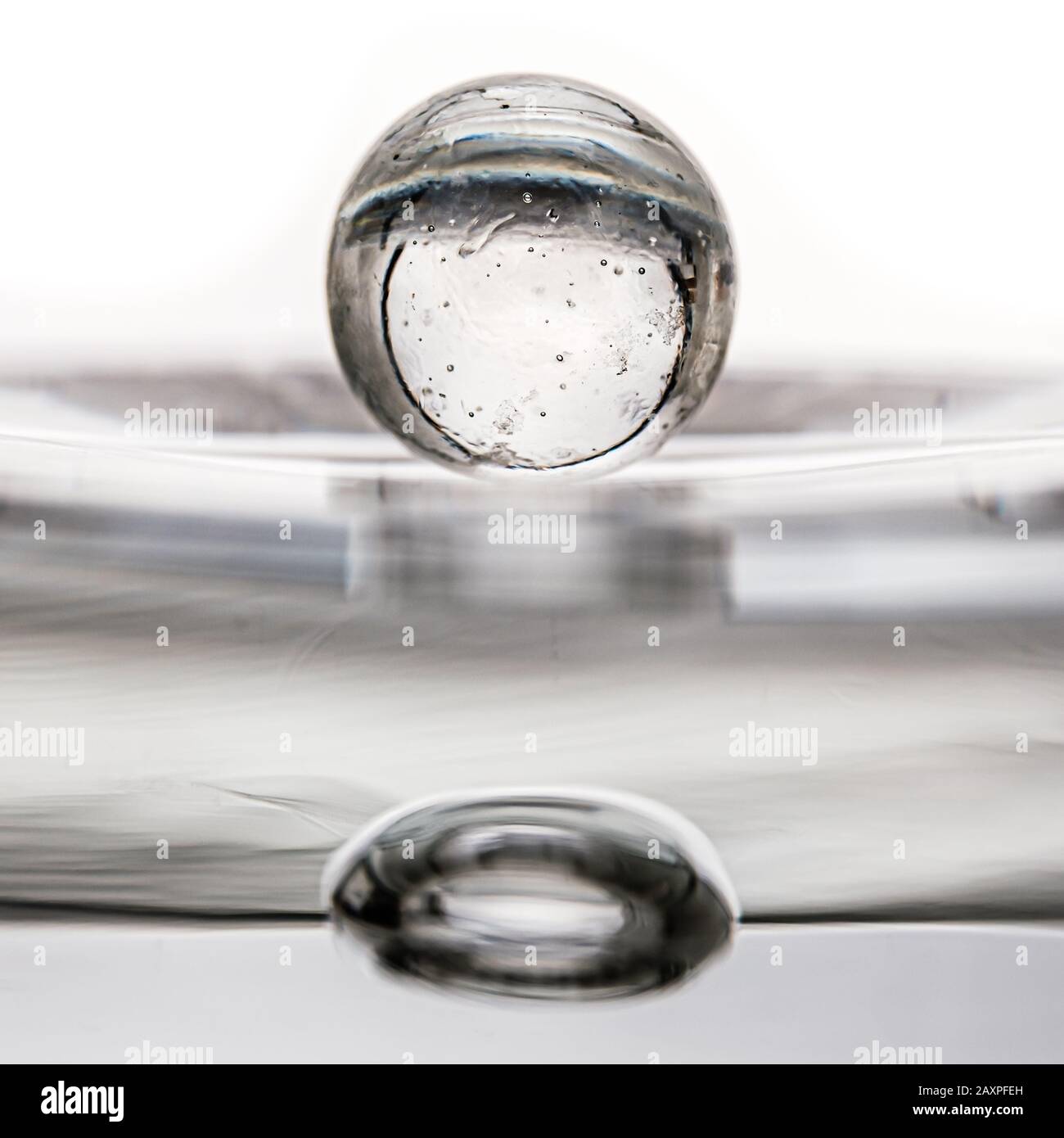 A marble on top of glass Stock Photo - Alamy