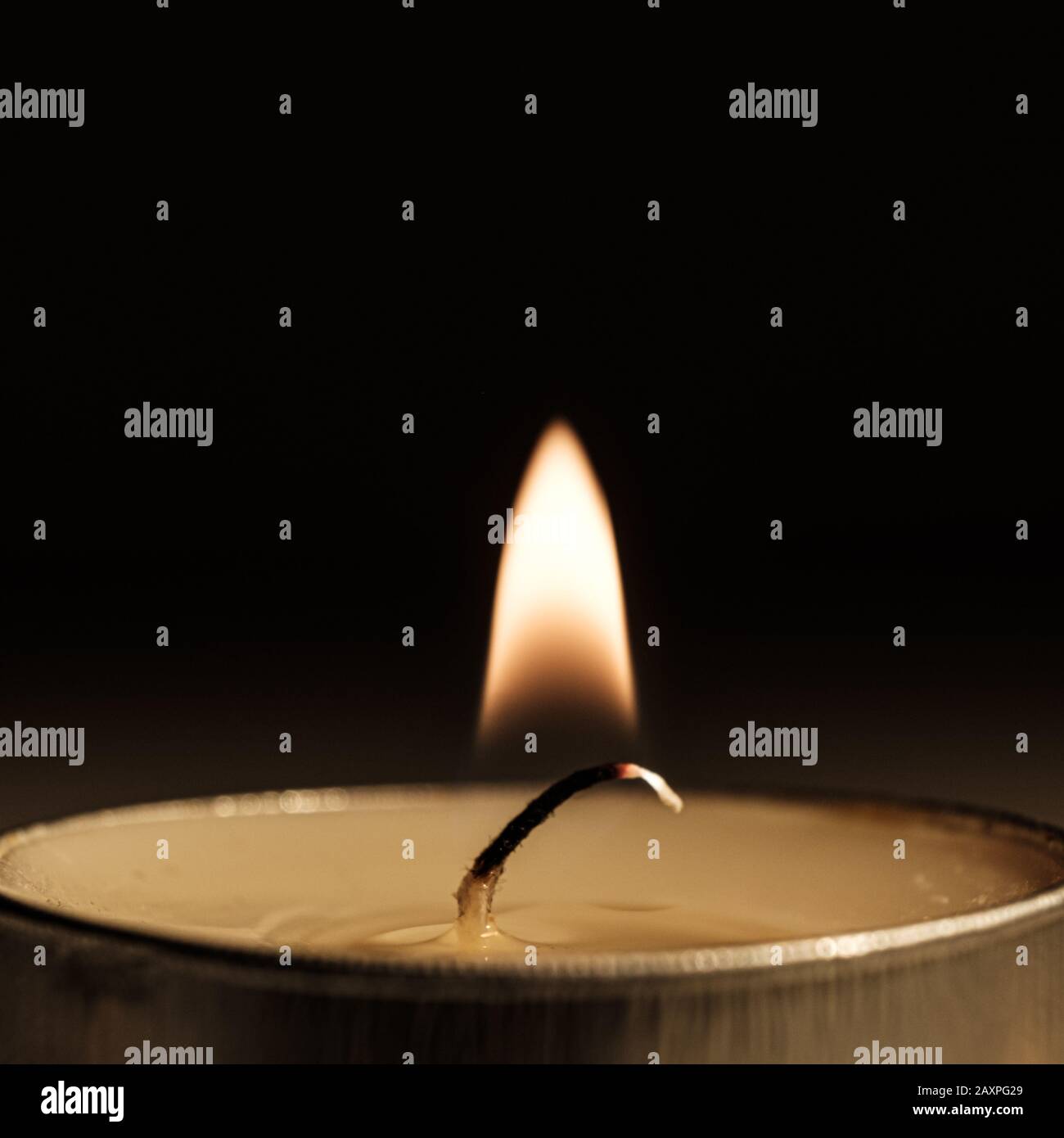 A little candle light and flame close-up Stock Photo - Alamy