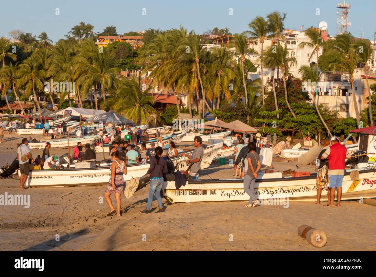 Puerto Escondido, Oaxaca, Mexico - People arrive at dawn on Puerto ...