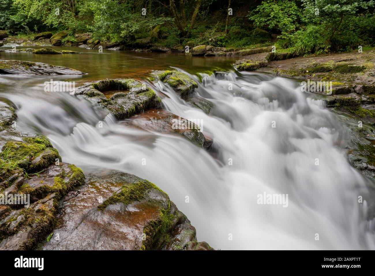 Long exposure of the waterfall at Watersmeet bridge pool at Watersmeet ...