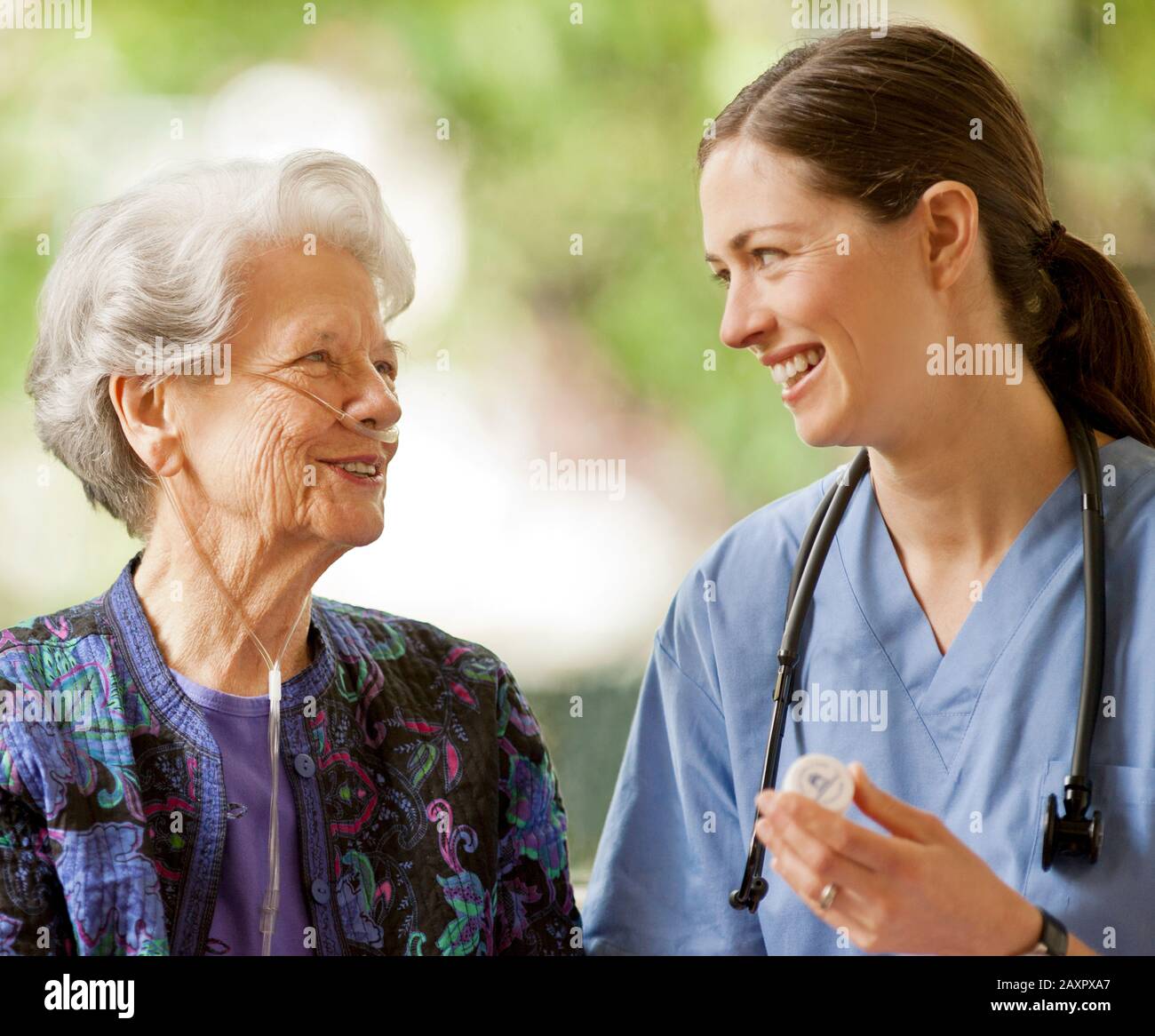 Senior woman comforted by adult hi-res stock photography and images - Alamy