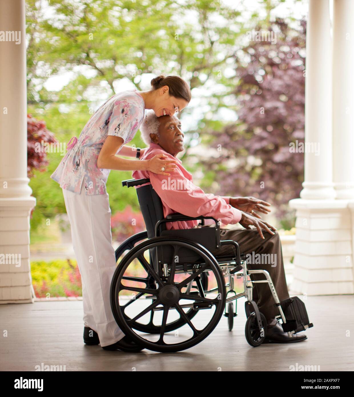 Senior woman comforted by adult hi-res stock photography and images - Alamy