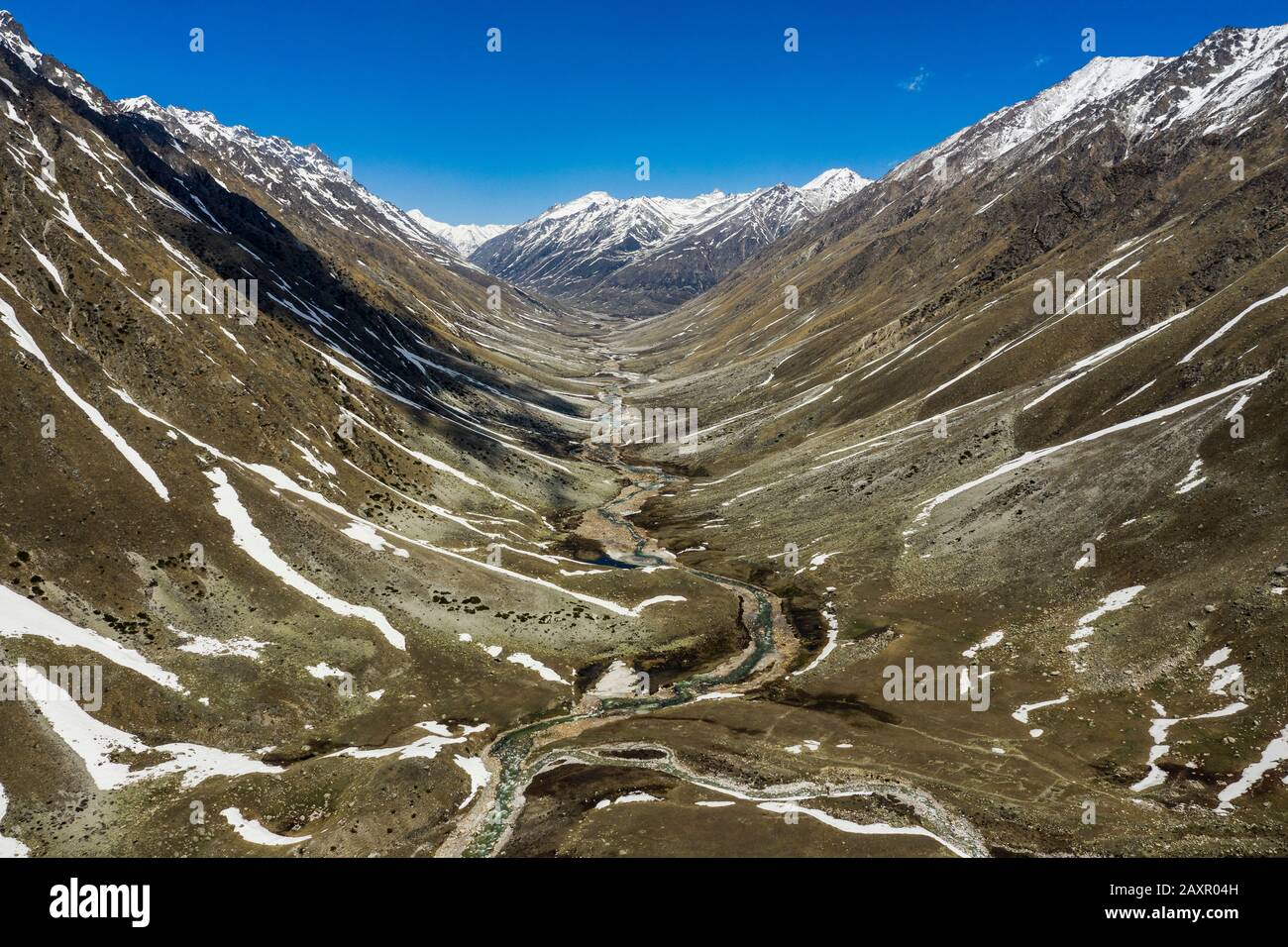 Rugged alpine river valley with snowy mountains, Nepal Himalaya Stock ...
