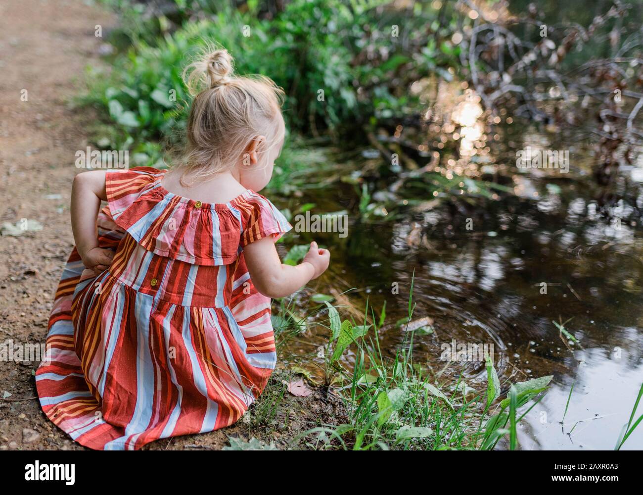 Boy enjoying a pond hi-res stock photography and images - Alamy