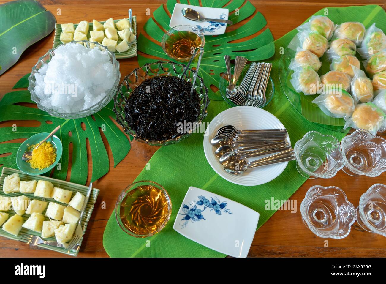 Mixed dessert in high tea break pineapple bread cream and ice black ...