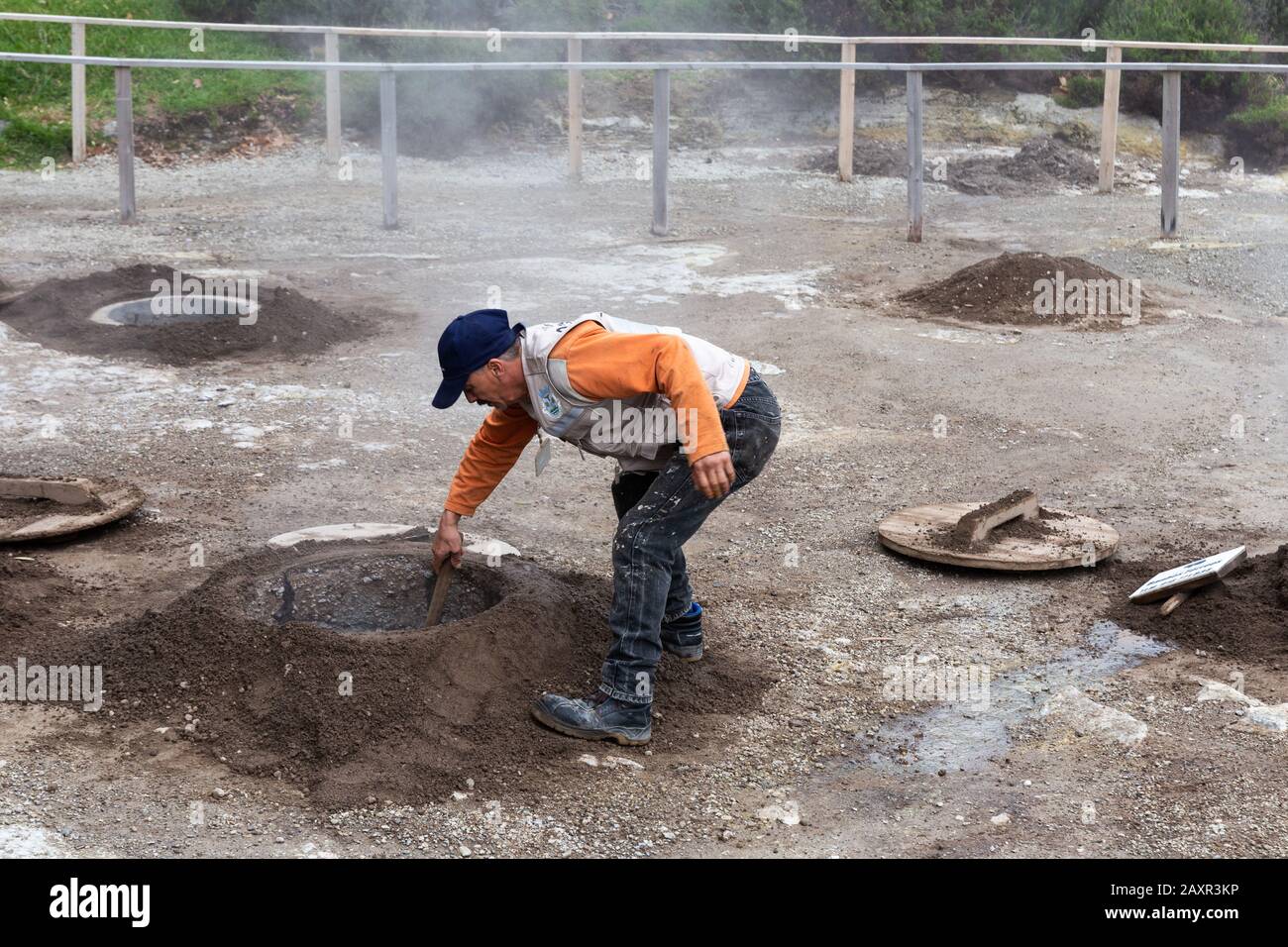 Furnas, Azores - February 2020: Three men removing "Cozido das Furnas ...