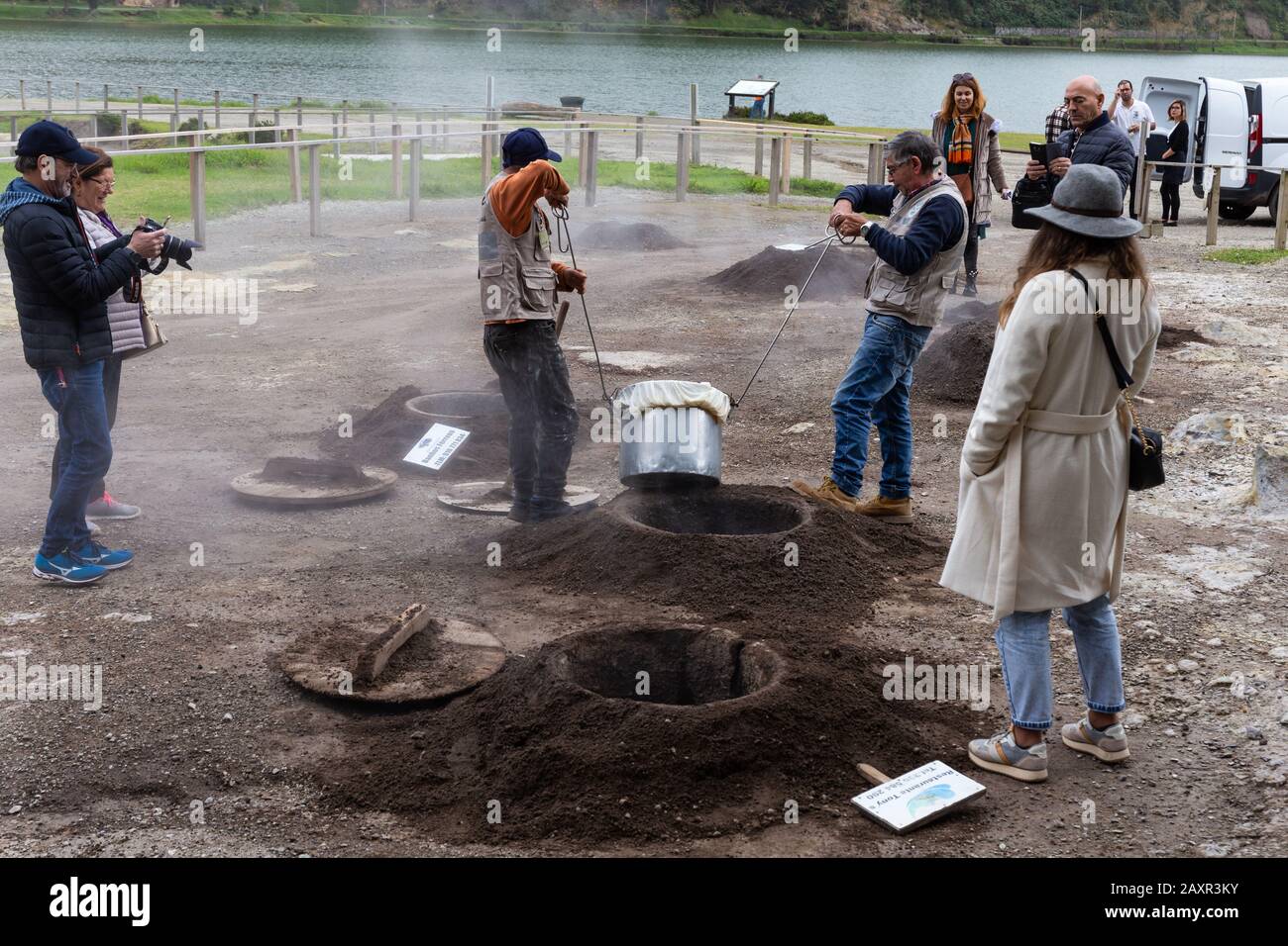 Furnas, Azores - February 2020: Three men removing "Cozido das Furnas ...