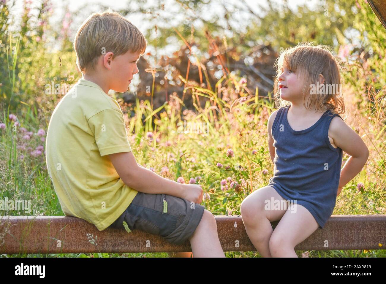 Little girl and boy talking to each other, Norway Stock Photo - Alamy