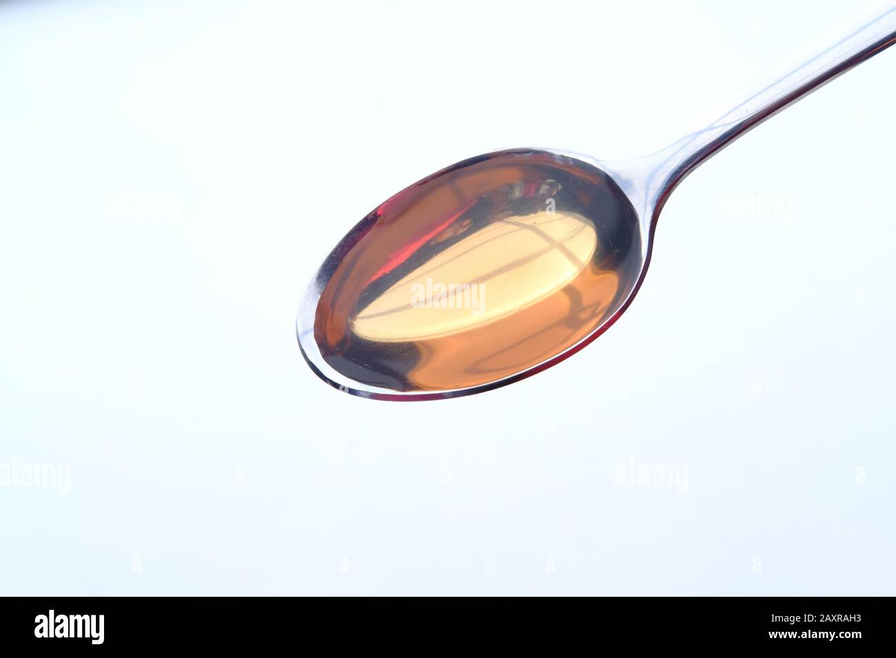 Liquid medicine pouring into spoon hi-res stock photography and images ...