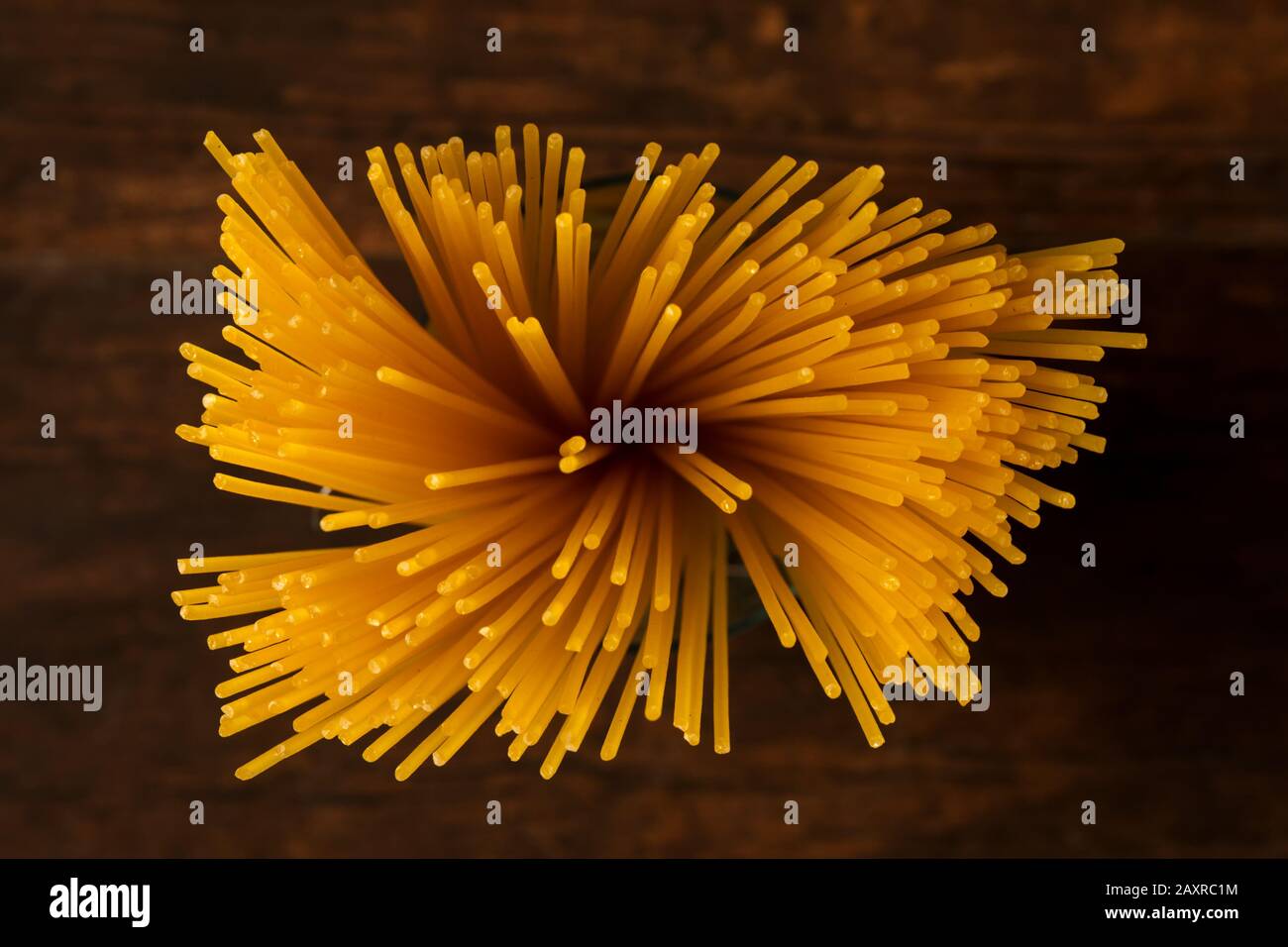 Gluten free pasta on dark background. Top view of raw spaghetti ...