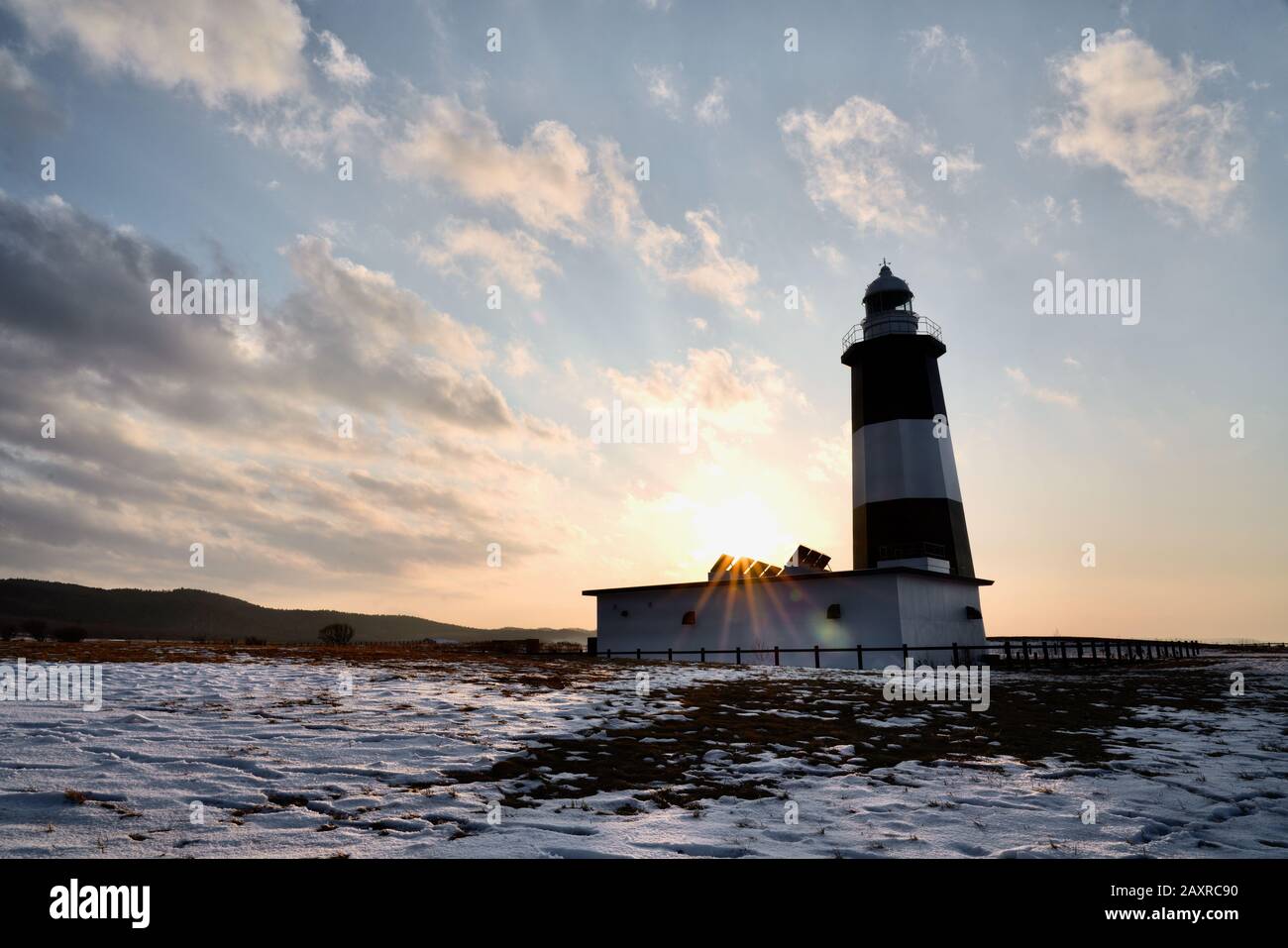 Sunset at Cape Notoro with Notoromisaki Lighthouse in winter, Abashiri ...