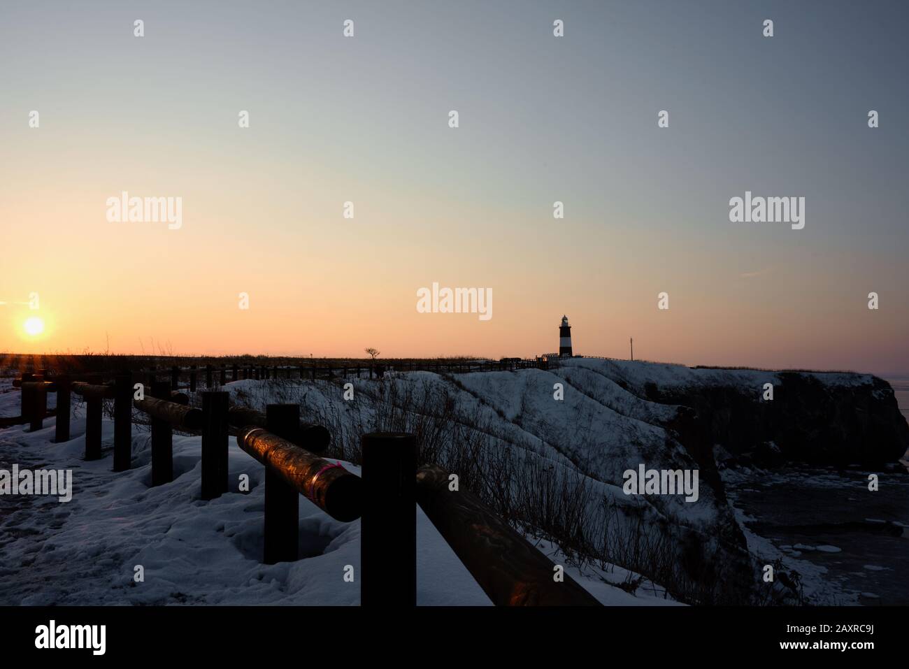 Sunset at Cape Notoro with Notoromisaki Lighthouse in winter, Abashiri ...