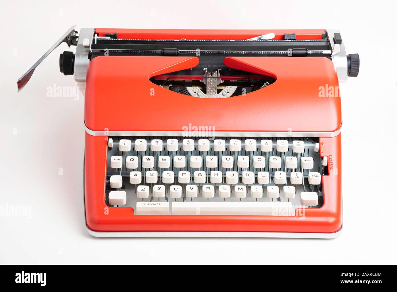 A studio shot of a retro-style portable manual typewriter with ivory ...