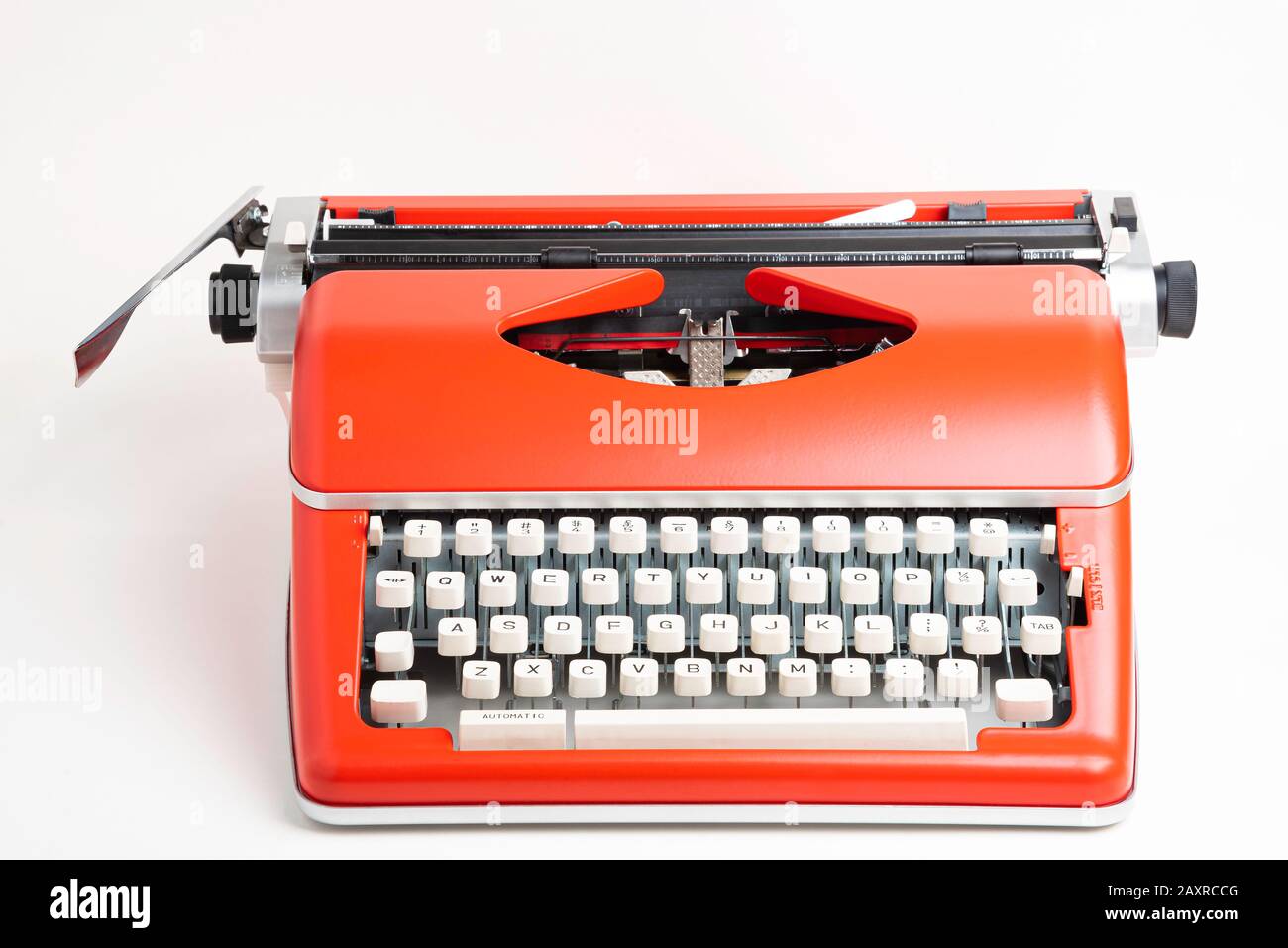 A studio shot of a retro-style portable manual typewriter with ivory ...