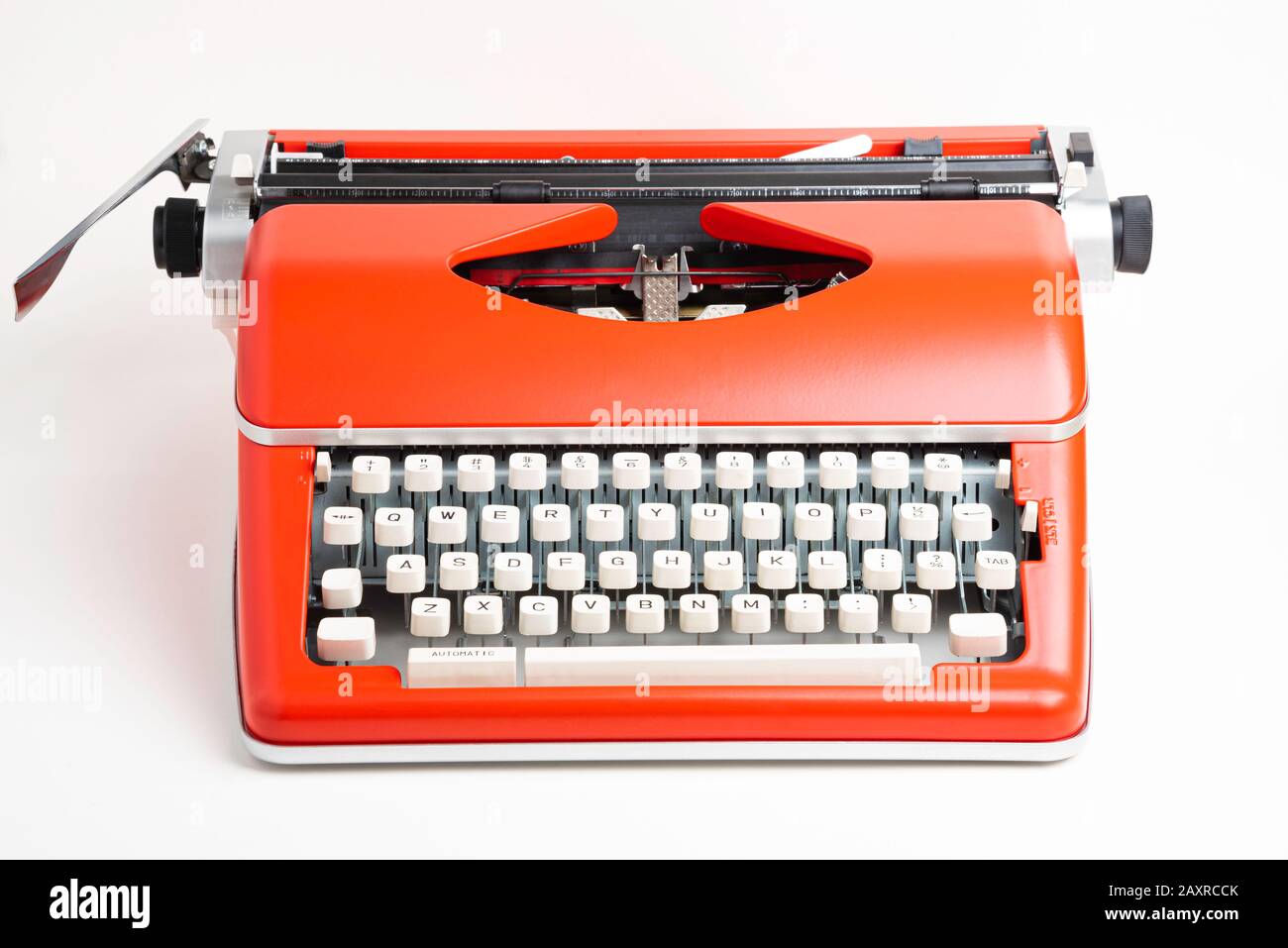 A studio shot of a retro-style portable manual typewriter with ivory ...