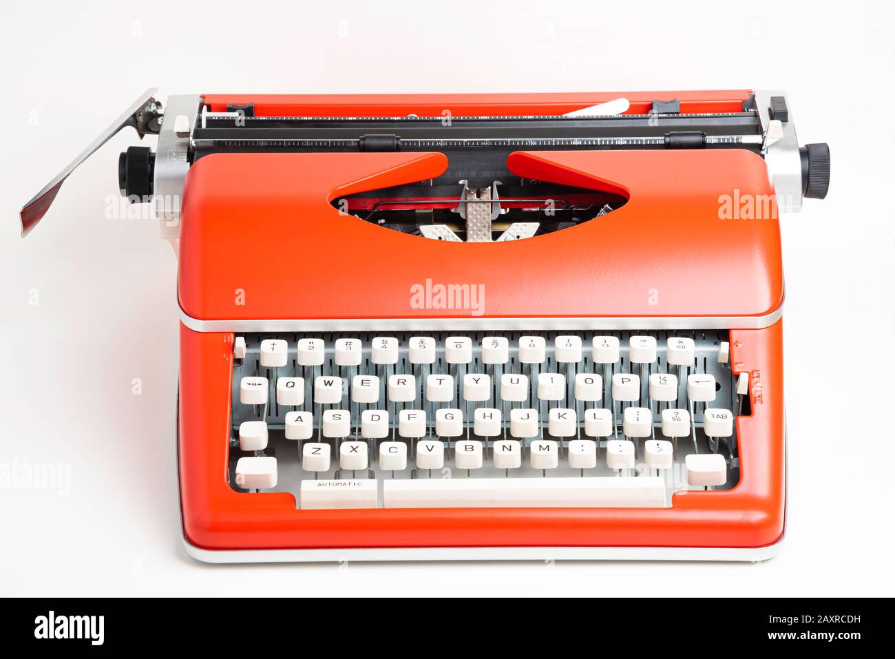 A studio shot of a retro-style portable manual typewriter with ivory ...