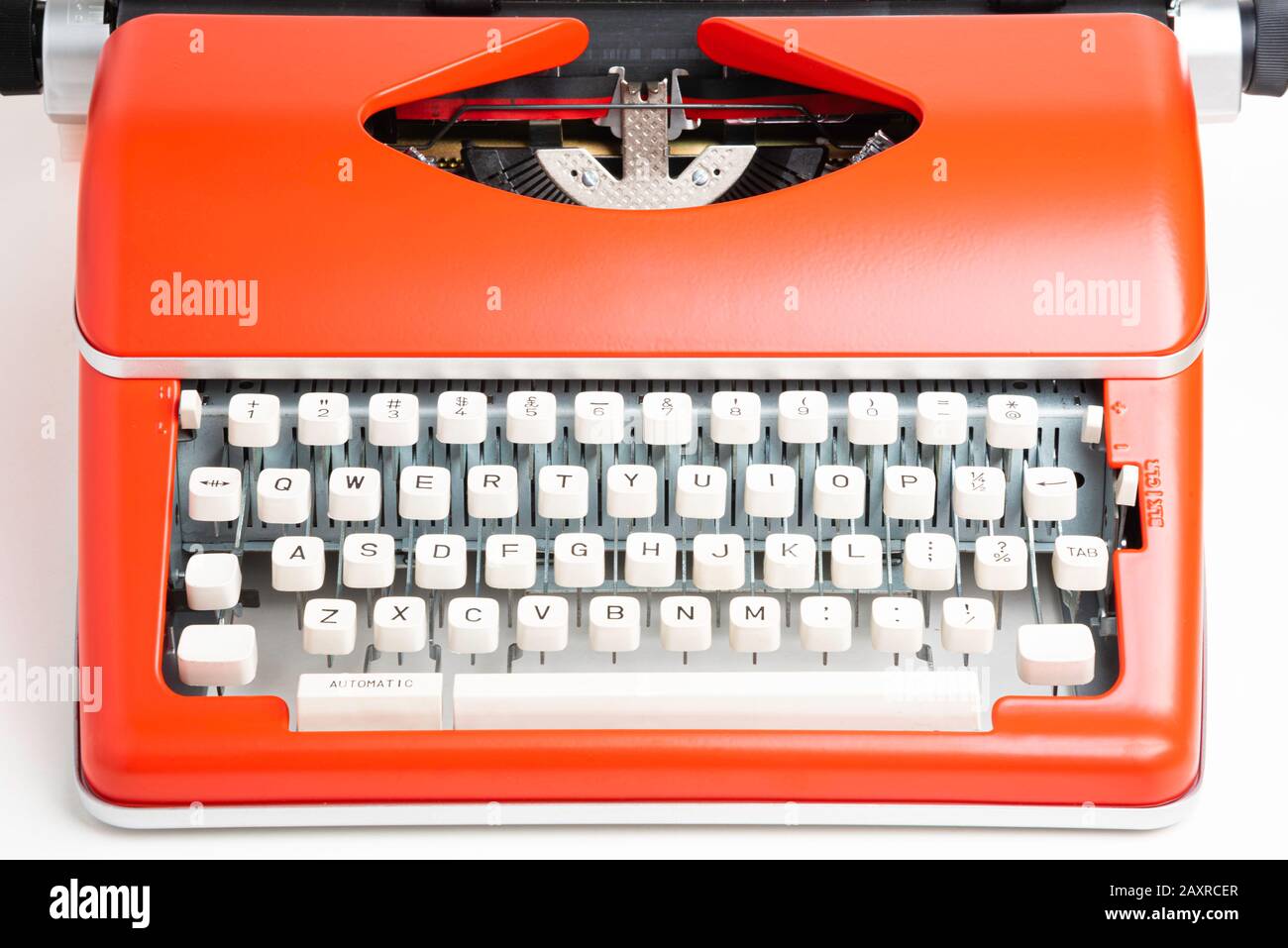 A studio shot of a retro-style portable manual typewriter with ivory ...