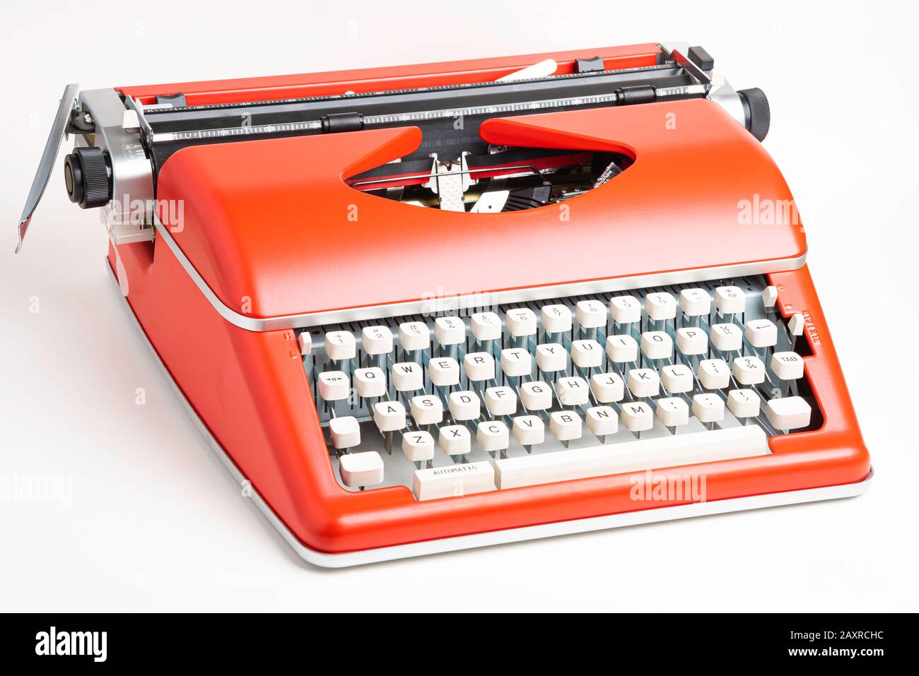 A studio shot of a retro-style portable manual typewriter with ivory ...