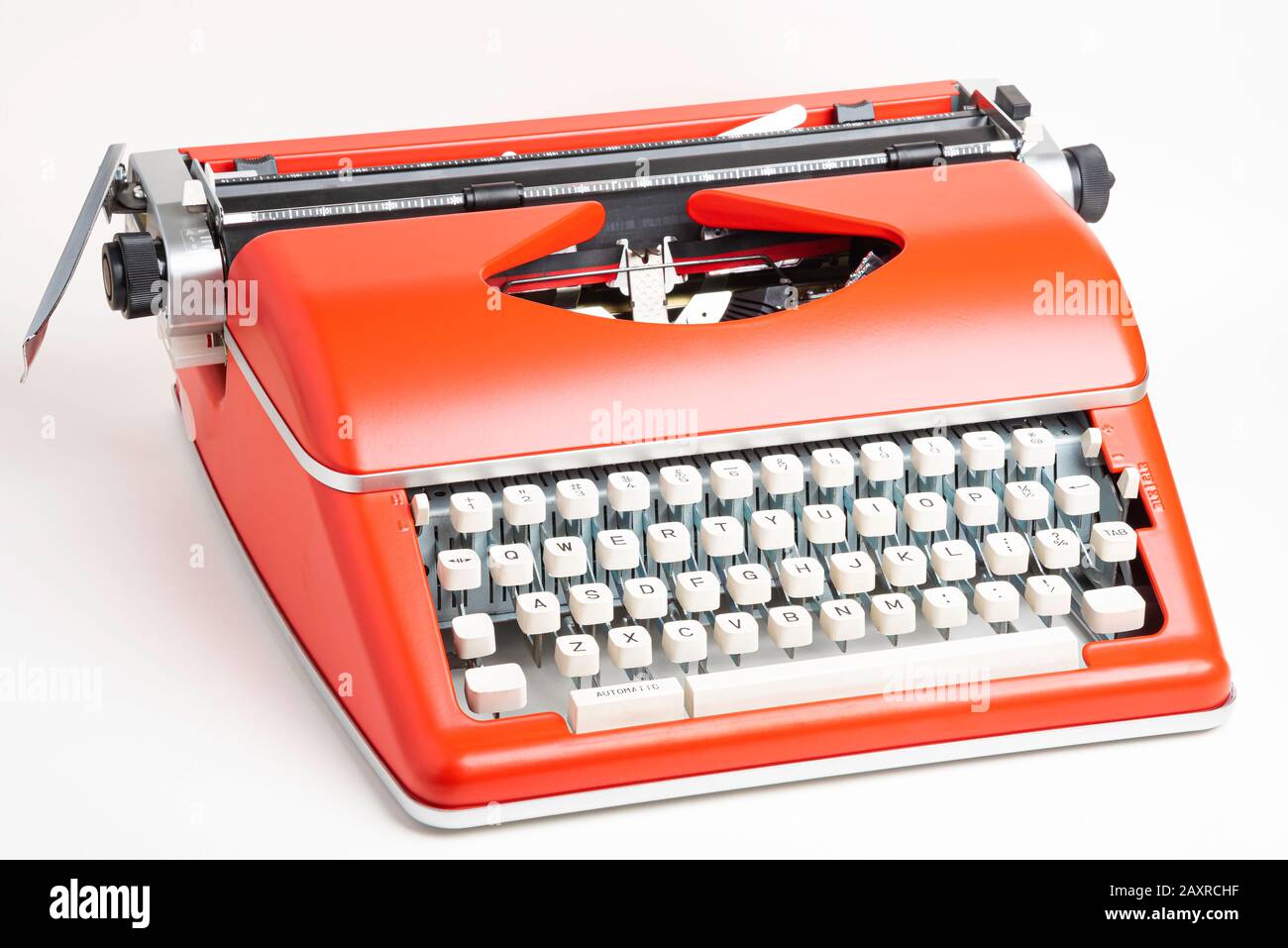 A studio shot of a retro-style portable manual typewriter with ivory ...