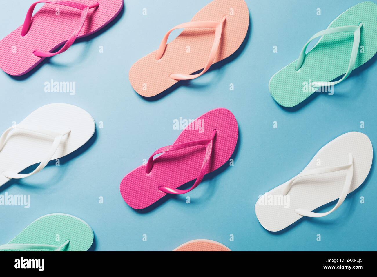Overhead view of flip flops on the blue background. Horizontal Stock ...