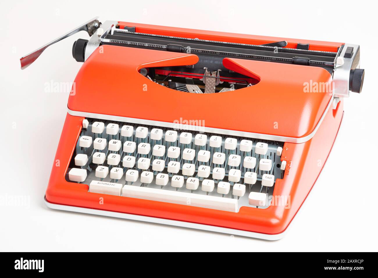 A studio shot of a retro-style portable manual typewriter with ivory ...