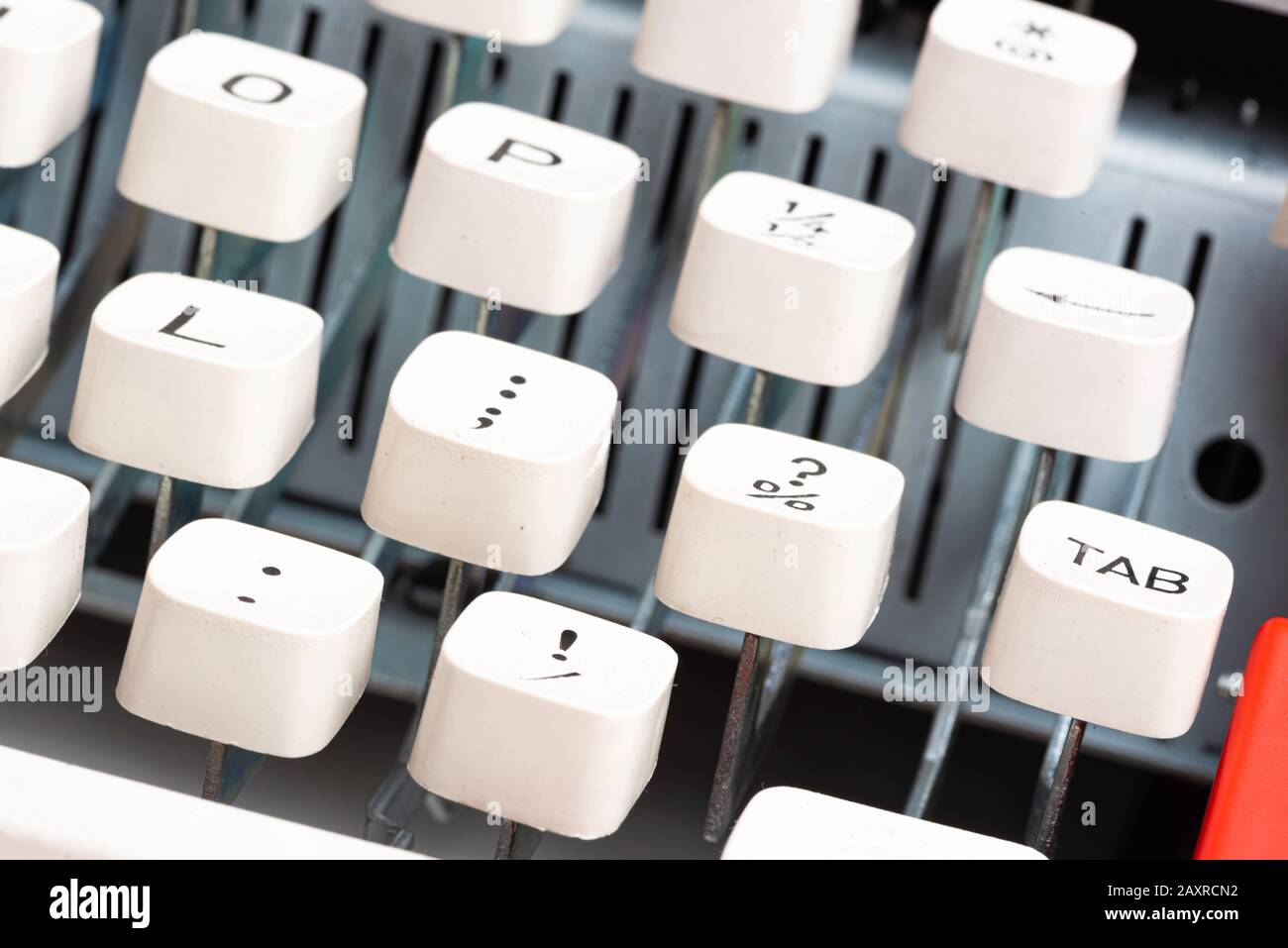 A studio shot of a retro-style portable manual typewriter with ivory ...