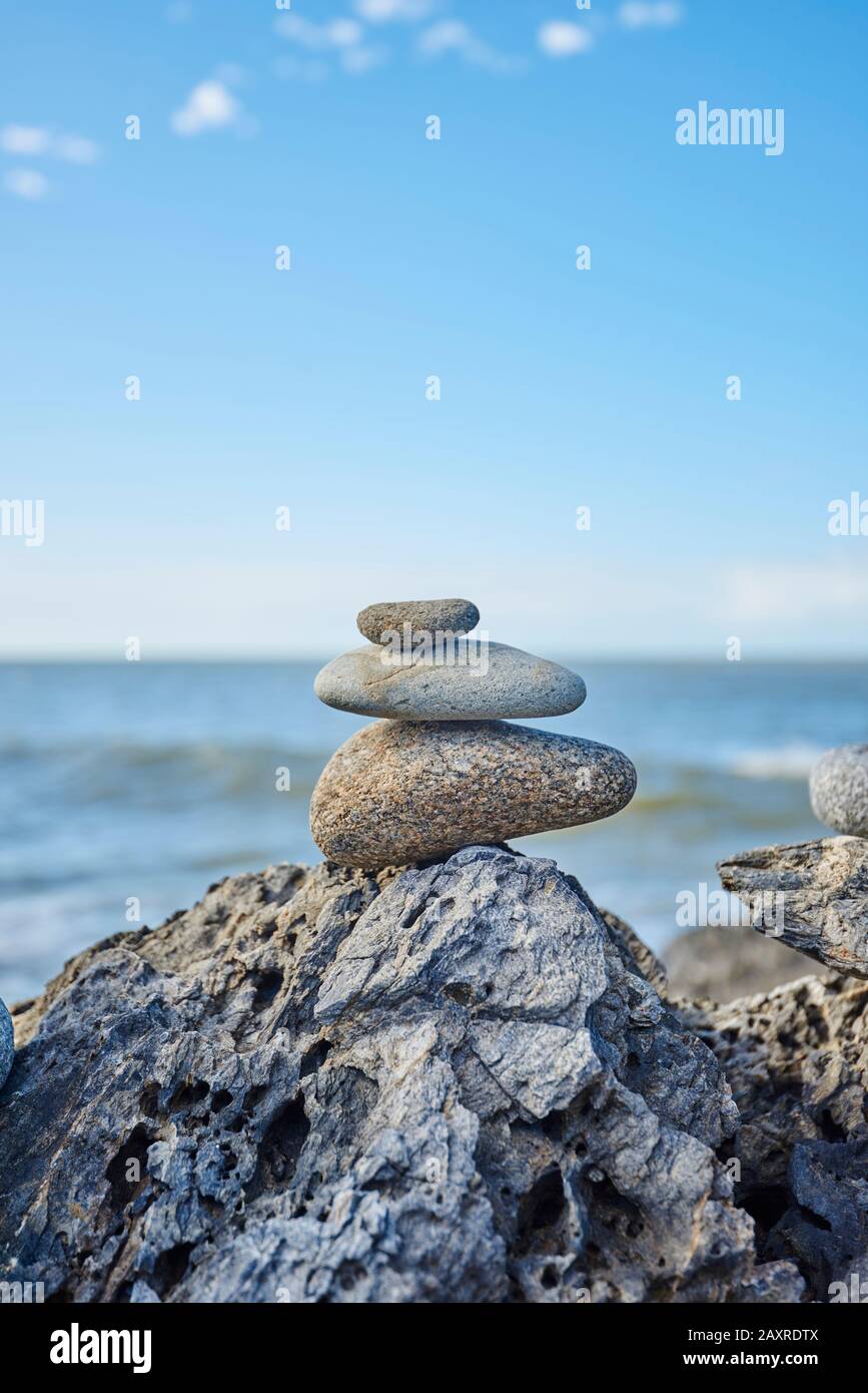 Stones, cairn at the beach, between Cairns and Port Douglas in spring ...